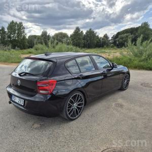 Black BMW 118 2011 in Riga, with an engine capacity of 2.00 L and mileage of 238 thousand km for 5750 €, photo 14 on AUTOMOTO.COM.LV