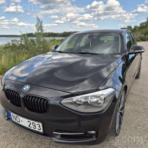 Black BMW 118 2011 in Riga, with an engine capacity of 2.00 L and mileage of 238 thousand km for 5750 €, photo 16 on AUTOMOTO.COM.LV