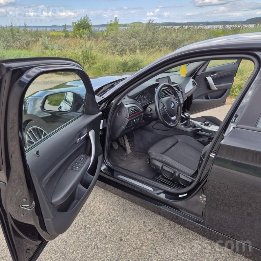Black BMW 118 2011 in Riga, with an engine capacity of 2.00 L and mileage of 238 thousand km for 5750 €, photo 18 on AUTOMOTO.COM.LV