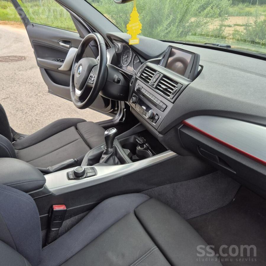Black BMW 118 2011 in Riga, with an engine capacity of 2.00 L and mileage of 238 thousand km for 5750 €, photo 20 on AUTOMOTO.COM.LV
