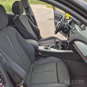 Black BMW 118 2011 in Riga, with an engine capacity of 2.00 L and mileage of 238 thousand km for 5750 €, photo 21 on AUTOMOTO.COM.LV