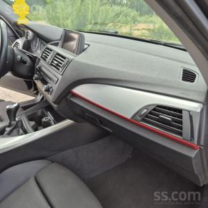 Black BMW 118 2011 in Riga, with an engine capacity of 2.00 L and mileage of 238 thousand km for 5750 €, photo 23 on AUTOMOTO.COM.LV