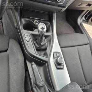 Black BMW 118 2011 in Riga, with an engine capacity of 2.00 L and mileage of 238 thousand km for 5750 €, photo 25 on AUTOMOTO.COM.LV