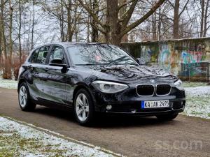 Black BMW 118 2012 in Riga, with an engine capacity of 1.80 L and mileage of 235 thousand km for 7200 €, photo 18 on AUTOMOTO.COM.LV