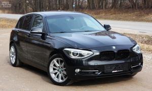 Melns BMW 118 2012 Petrikaičiai, ar dzinēja tilpumu 2.00 L un nobraukumu 139 tūkst. km par 8499 €, foto  vietnē AUTOMOTO.COM.LV