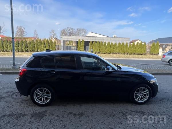 Black BMW 118 2012 in Riga, with an engine capacity of 2.00 L and mileage of 340 thousand km for 6990 €, photo 3 on AUTOMOTO.COM.LV