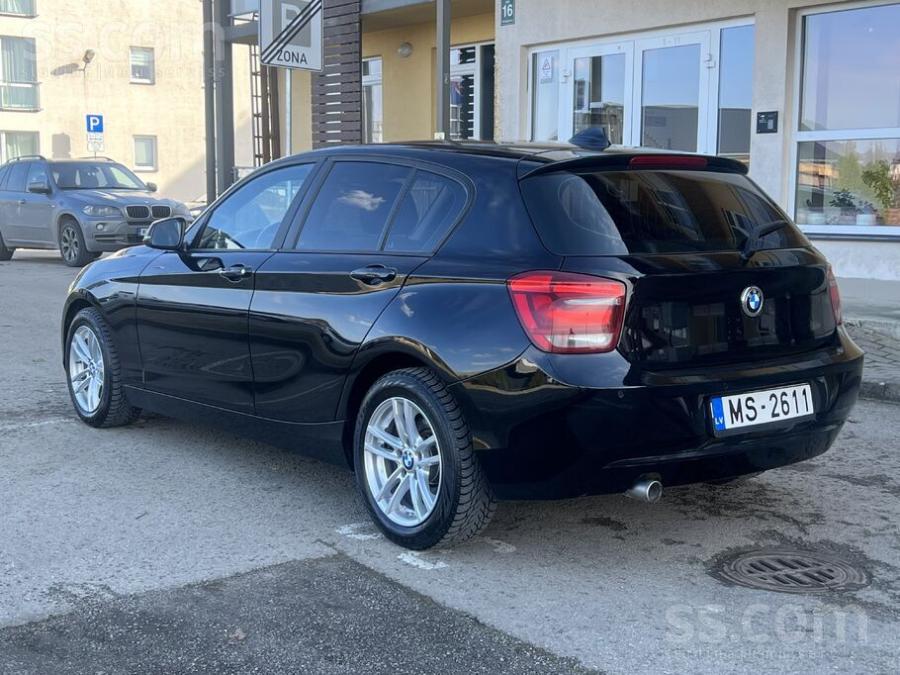 Black BMW 118 2012 in Riga, with an engine capacity of 2.00 L and mileage of 340 thousand km for 6990 €, photo 5 on AUTOMOTO.COM.LV