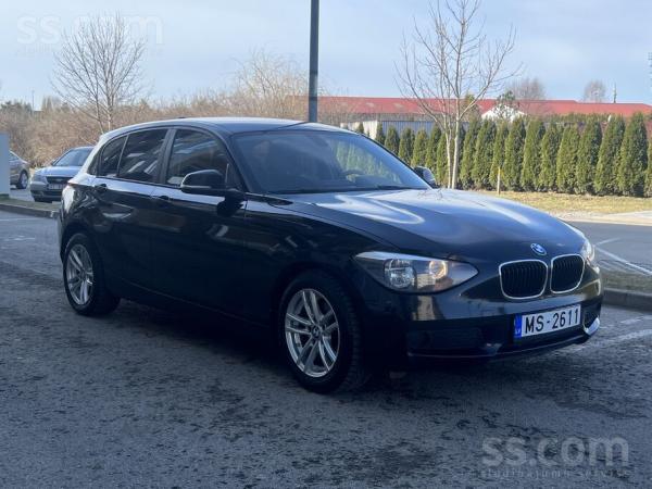 Black BMW 118 2012 in Riga, with an engine capacity of 2.00 L and mileage of 340 thousand km for 6990 €, photo 6 on AUTOMOTO.COM.LV
