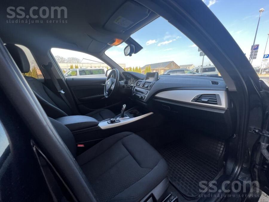 Black BMW 118 2012 in Riga, with an engine capacity of 2.00 L and mileage of 340 thousand km for 6990 €, photo 9 on AUTOMOTO.COM.LV