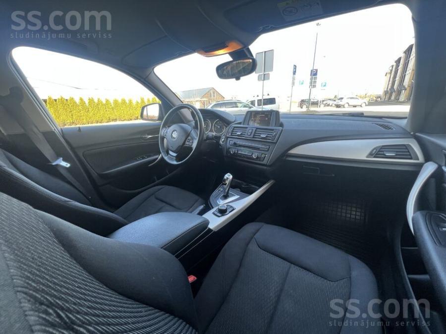 Black BMW 118 2012 in Riga, with an engine capacity of 2.00 L and mileage of 340 thousand km for 6990 €, photo 10 on AUTOMOTO.COM.LV