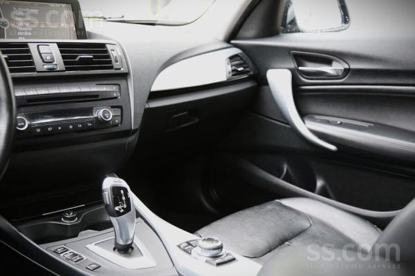 Black BMW 118 2012 in Riga, with an engine capacity of 2.00 L and mileage of 251 thousand km for 7995 €, photo 9 on AUTOMOTO.COM.LV