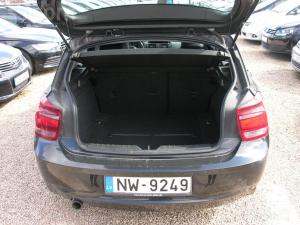 Black BMW 118 2012 in Riga, with an engine capacity of 2.00 L and mileage of 0 thousand km for 8550 €, photo 6 on AUTOMOTO.COM.LV
