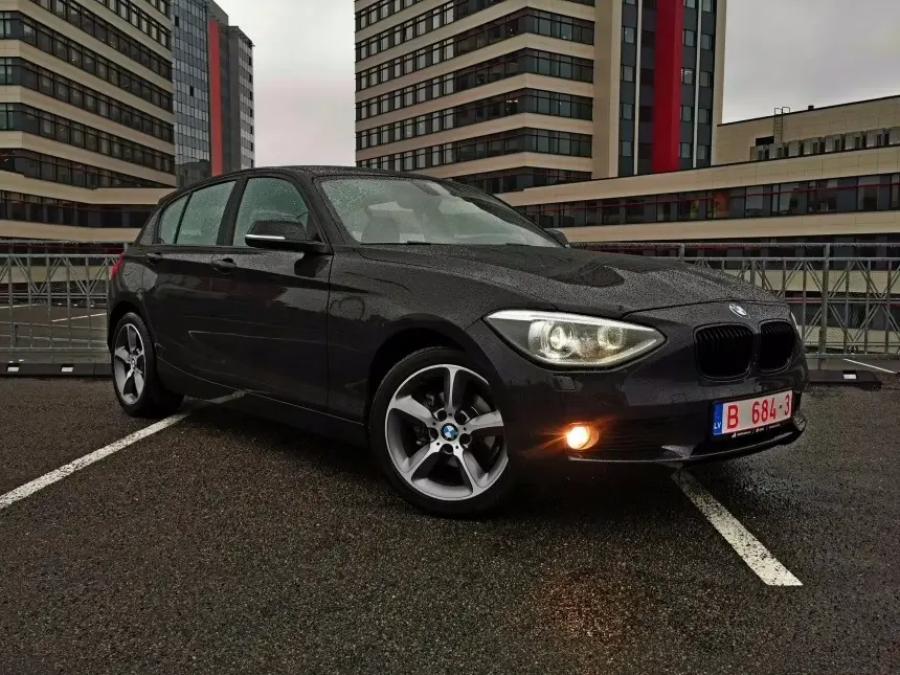 Black BMW 118 2012 in Riga, with an engine capacity of 2.00 L and mileage of 235 thousand km for 9990 €, photo 1 on AUTOMOTO.COM.LV