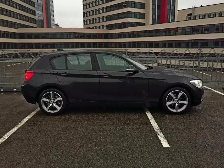 Black BMW 118 2012 in Riga, with an engine capacity of 2.00 L and mileage of 235 thousand km for 9990 €, photo 5 on AUTOMOTO.COM.LV