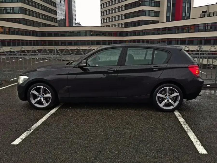 Black BMW 118 2012 in Riga, with an engine capacity of 2.00 L and mileage of 235 thousand km for 9990 €, photo 6 on AUTOMOTO.COM.LV
