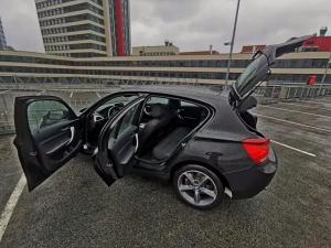 Black BMW 118 2012 in Riga, with an engine capacity of 2.00 L and mileage of 235 thousand km for 9990 €, photo 9 on AUTOMOTO.COM.LV