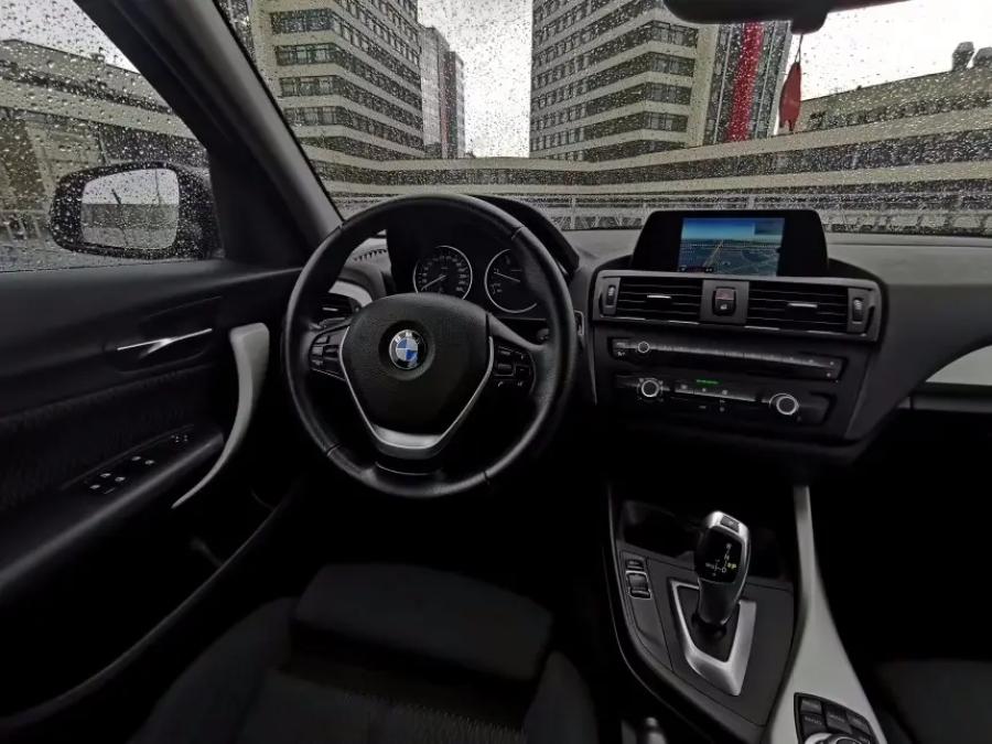 Black BMW 118 2012 in Riga, with an engine capacity of 2.00 L and mileage of 235 thousand km for 9990 €, photo 12 on AUTOMOTO.COM.LV