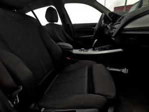 Black BMW 118 2012 in Riga, with an engine capacity of 2.00 L and mileage of 235 thousand km for 9990 €, photo 13 on AUTOMOTO.COM.LV