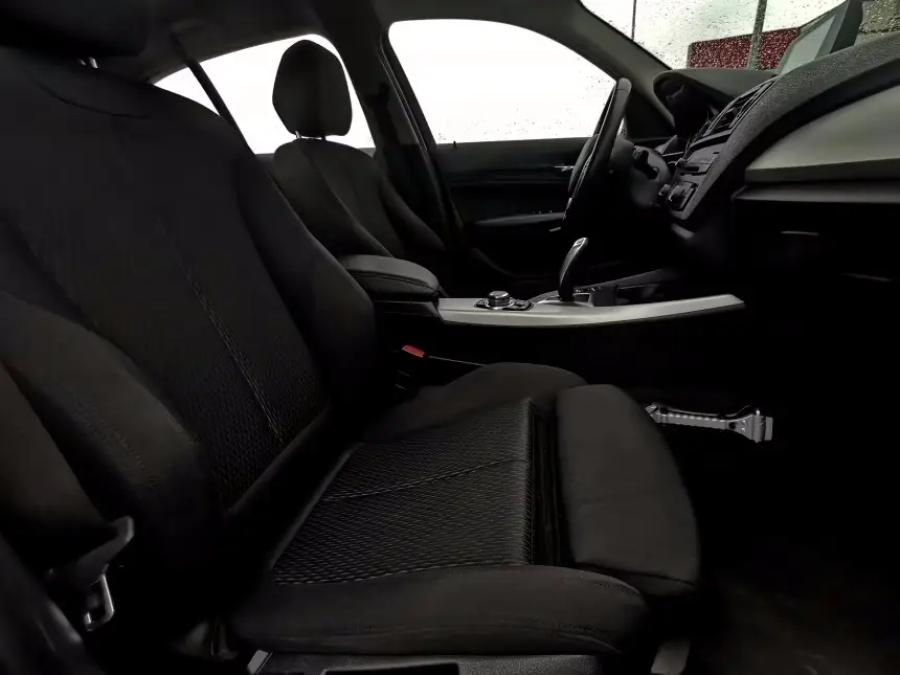 Black BMW 118 2012 in Riga, with an engine capacity of 2.00 L and mileage of 235 thousand km for 9990 €, photo 13 on AUTOMOTO.COM.LV