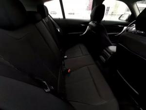 Black BMW 118 2012 in Riga, with an engine capacity of 2.00 L and mileage of 235 thousand km for 9990 €, photo 14 on AUTOMOTO.COM.LV