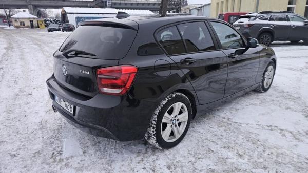 Black BMW 118 2013 in Riga, with an engine capacity of 2.00 L and mileage of 302 thousand km for 6500 €, photo 4 on AUTOMOTO.COM.LV