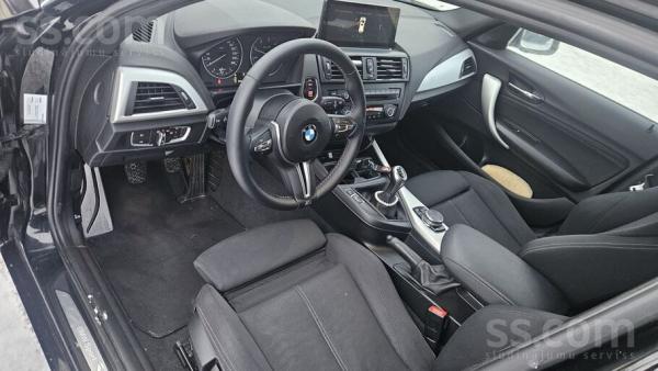 Black BMW 118 2013 in Riga, with an engine capacity of 2.00 L and mileage of 302 thousand km for 6500 €, photo 8 on AUTOMOTO.COM.LV