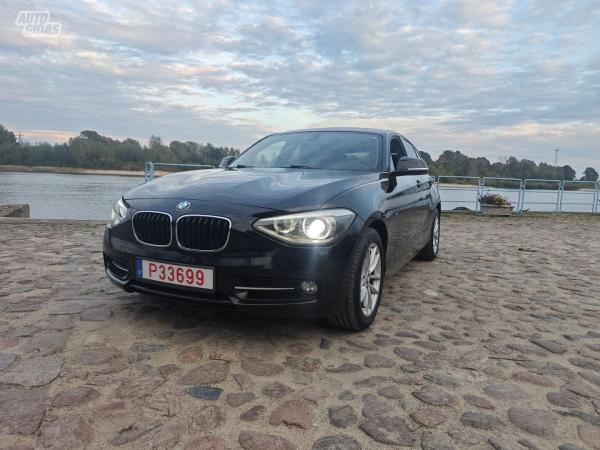 Black BMW 118 2013 in Silute, with an engine capacity of 2.00 L and mileage of 245 thousand km for 6400 €, photo 3 on AUTOMOTO.COM.LV