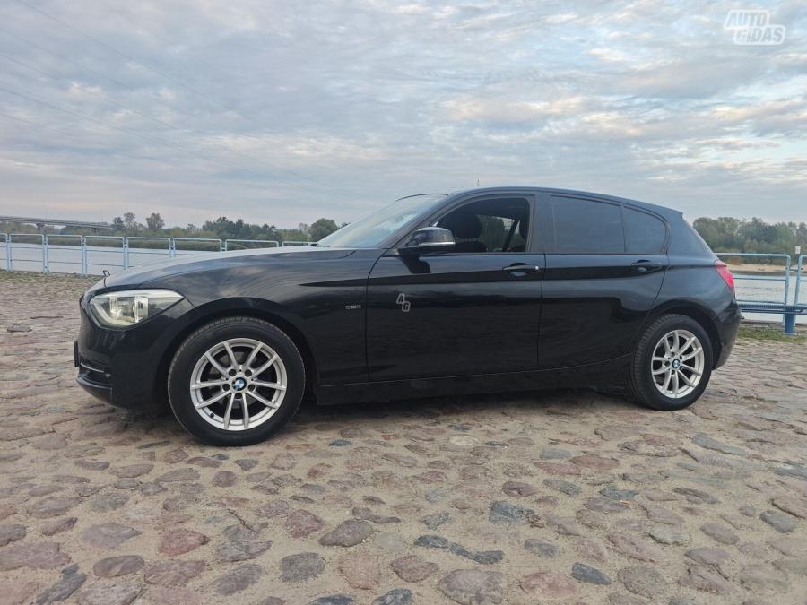 Black BMW 118 2013 in Silute, with an engine capacity of 2.00 L and mileage of 245 thousand km for 6400 €, photo 4 on AUTOMOTO.COM.LV