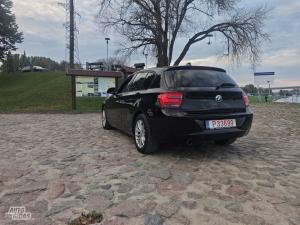Black BMW 118 2013 in Silute, with an engine capacity of 2.00 L and mileage of 245 thousand km for 6400 €, photo 5 on AUTOMOTO.COM.LV