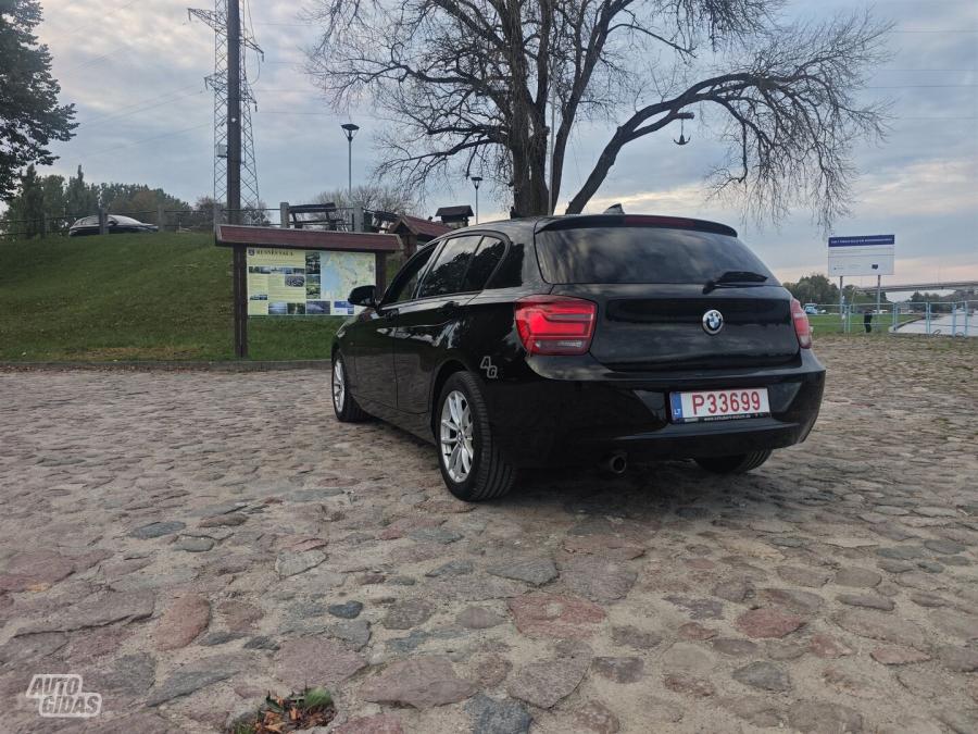 Black BMW 118 2013 in Silute, with an engine capacity of 2.00 L and mileage of 245 thousand km for 6400 €, photo 5 on AUTOMOTO.COM.LV