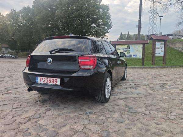 Black BMW 118 2013 in Silute, with an engine capacity of 2.00 L and mileage of 245 thousand km for 6400 €, photo 6 on AUTOMOTO.COM.LV