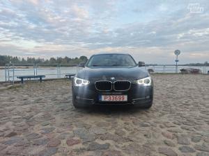 Black BMW 118 2013 in Silute, with an engine capacity of 2.00 L and mileage of 245 thousand km for 6400 €, photo 8 on AUTOMOTO.COM.LV