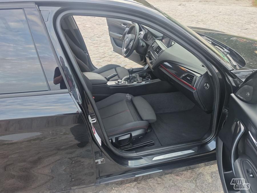 Black BMW 118 2013 in Silute, with an engine capacity of 2.00 L and mileage of 245 thousand km for 6400 €, photo 10 on AUTOMOTO.COM.LV