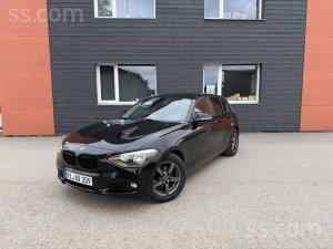 Black BMW 118 2014 in Cesis, with an engine capacity of 2.00 L and mileage of 252 thousand km for 7990 €, photo 1 on AUTOMOTO.COM.LV