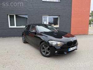 Black BMW 118 2014 in Cesis, with an engine capacity of 2.00 L and mileage of 252 thousand km for 7990 €, photo 3 on AUTOMOTO.COM.LV