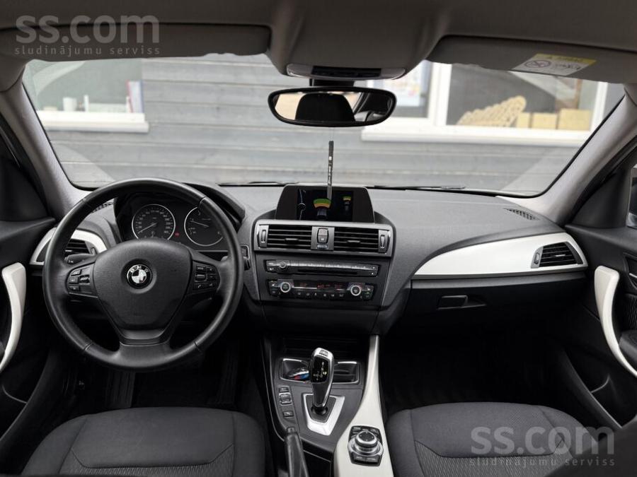 Black BMW 118 2014 in Cesis, with an engine capacity of 2.00 L and mileage of 252 thousand km for 7990 €, photo 7 on AUTOMOTO.COM.LV