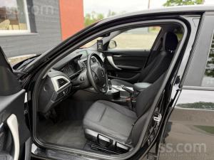Black BMW 118 2014 in Cesis, with an engine capacity of 2.00 L and mileage of 252 thousand km for 7990 €, photo 8 on AUTOMOTO.COM.LV