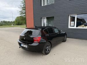 Black BMW 118 2014 in Cesis, with an engine capacity of 2.00 L and mileage of 252 thousand km for 7990 €, photo 21 on AUTOMOTO.COM.LV