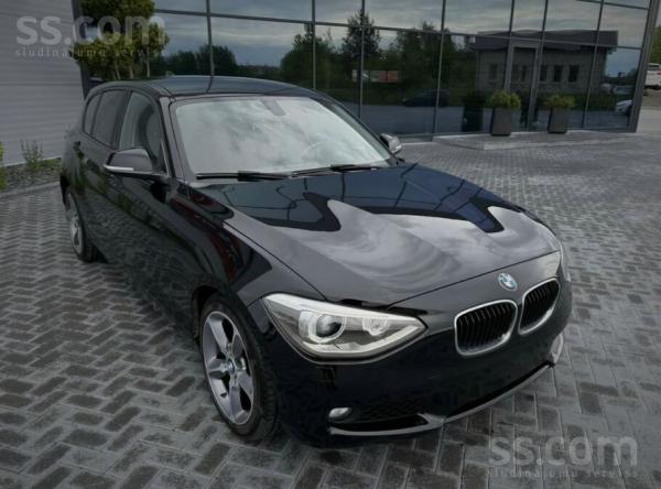 Black BMW 118 2014 in Telschi, with an engine capacity of 2.00 L and mileage of 201 thousand km for 6699 €, photo 1 on AUTOMOTO.COM.LV