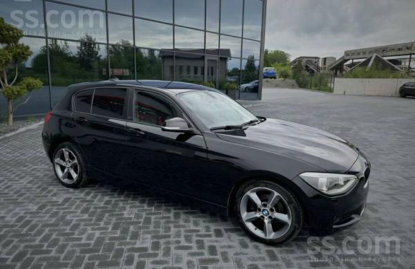 Black BMW 118 2014 in Telschi, with an engine capacity of 2.00 L and mileage of 201 thousand km for 6699 €, photo 2 on AUTOMOTO.COM.LV