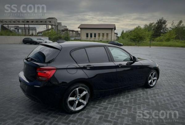 Black BMW 118 2014 in Telschi, with an engine capacity of 2.00 L and mileage of 201 thousand km for 6699 €, photo 6 on AUTOMOTO.COM.LV