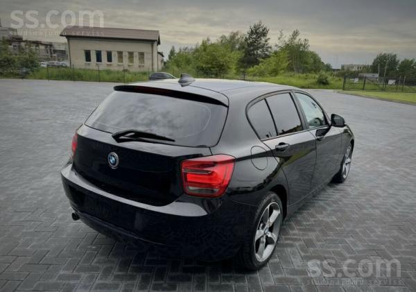 Black BMW 118 2014 in Telschi, with an engine capacity of 2.00 L and mileage of 201 thousand km for 6699 €, photo 10 on AUTOMOTO.COM.LV