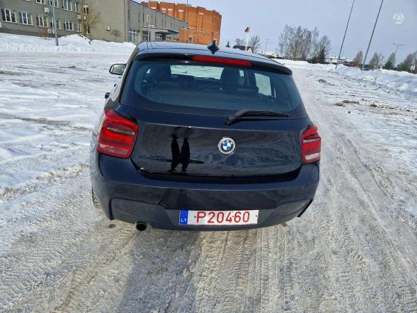 Black BMW 118 2014 in Kaunas, with an engine capacity of 2.00 L and mileage of 211 thousand km for 8250 €, photo 10 on AUTOMOTO.COM.LV