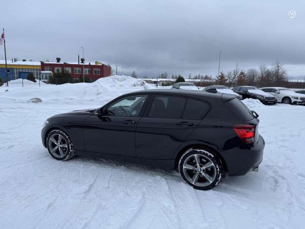 Black BMW 118 2014 in Telschi, with an engine capacity of 2.00 L and mileage of 202 thousand km for 6999 €, photo 3 on AUTOMOTO.COM.LV