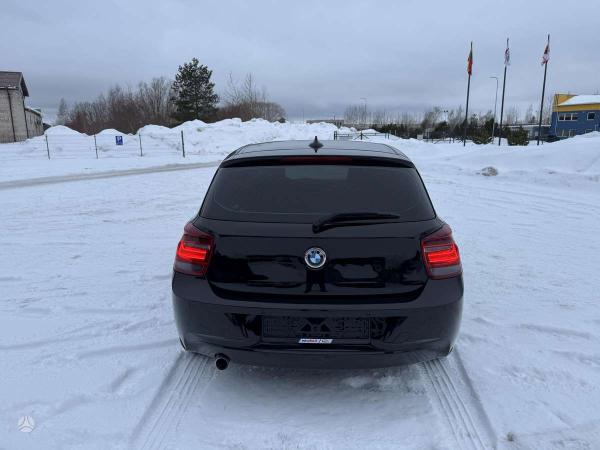 Black BMW 118 2014 in Telschi, with an engine capacity of 2.00 L and mileage of 202 thousand km for 6999 €, photo 5 on AUTOMOTO.COM.LV