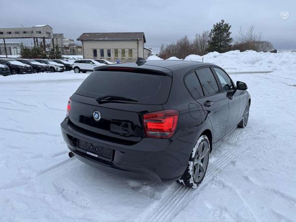 Black BMW 118 2014 in Telschi, with an engine capacity of 2.00 L and mileage of 202 thousand km for 6999 €, photo 6 on AUTOMOTO.COM.LV