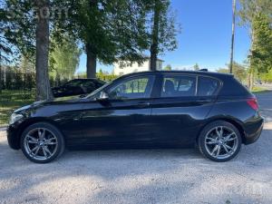 Black BMW 118 2014 in Riga, with an engine capacity of 2.00 L and mileage of 180 thousand km for 7990 €, photo 3 on AUTOMOTO.COM.LV