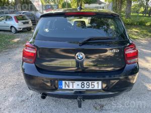 Black BMW 118 2014 in Riga, with an engine capacity of 2.00 L and mileage of 180 thousand km for 7990 €, photo 5 on AUTOMOTO.COM.LV
