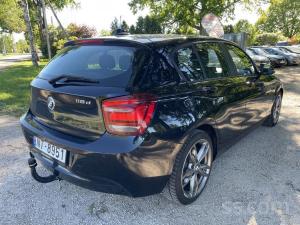 Black BMW 118 2014 in Riga, with an engine capacity of 2.00 L and mileage of 180 thousand km for 7990 €, photo 6 on AUTOMOTO.COM.LV