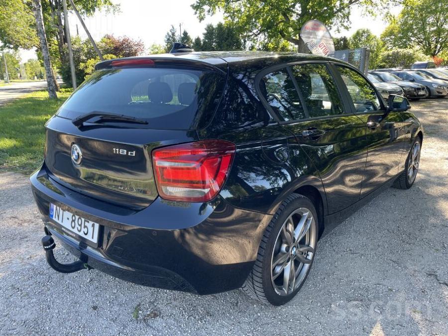 Black BMW 118 2014 in Riga, with an engine capacity of 2.00 L and mileage of 180 thousand km for 7990 €, photo 6 on AUTOMOTO.COM.LV